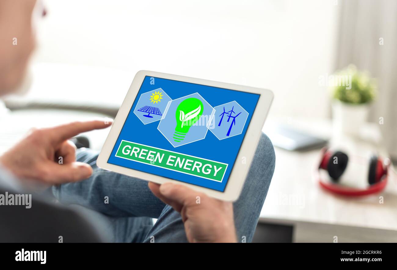 Tablet screen displaying a green energy concept Stock Photo - Alamy