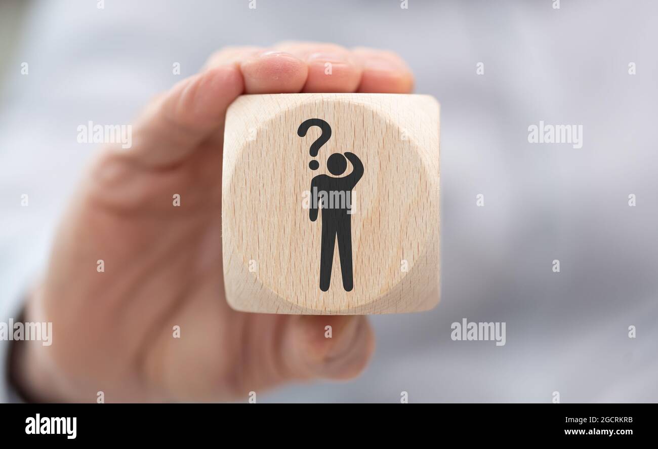 Hand holding a wooden cube with symbol of question concept Stock Photo ...
