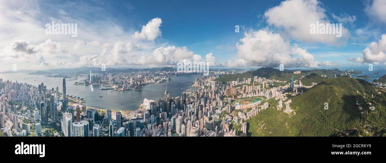 epic aerial view of the Victoria Harbour, Hong Kong, in a clear sky day ...