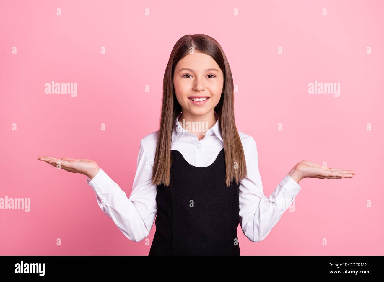 Photo of young school girl happy positive smile hold hands advert pros ...