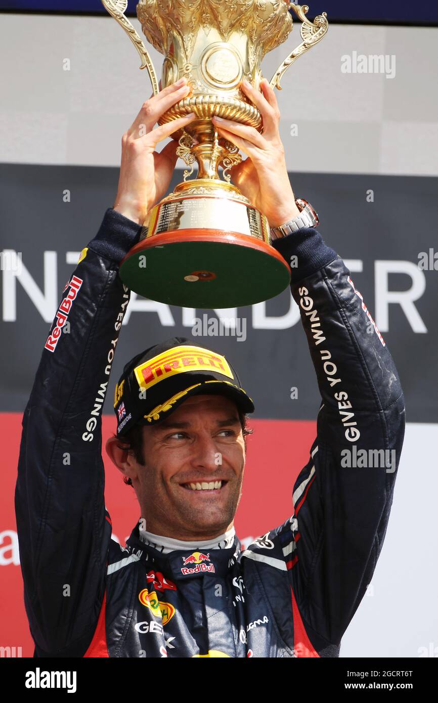 Race winner Mark Webber (AUS) Red Bull Racing celebrates on the podium ...