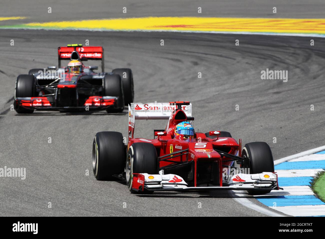 Ferrari f2012 leads a lapped lewis hamilton hi-res stock photography ...