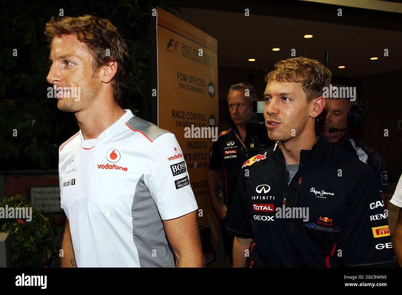 (L to R): Jenson Button (GBR) McLaren and Sebastian Vettel (GER) Red ...