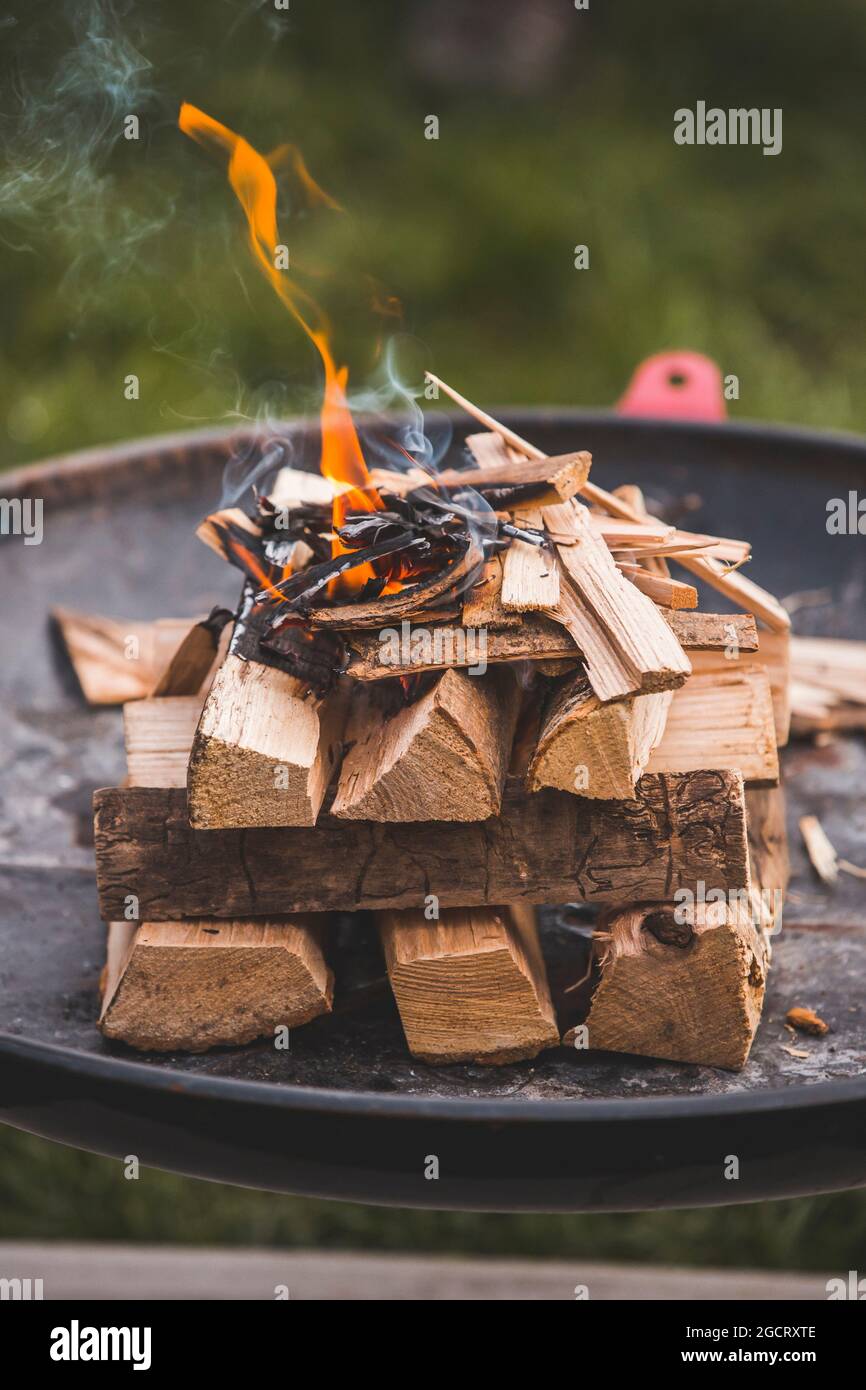 Starting an a open fire in a fire pit in Ashton Court Estate, Bristol ...