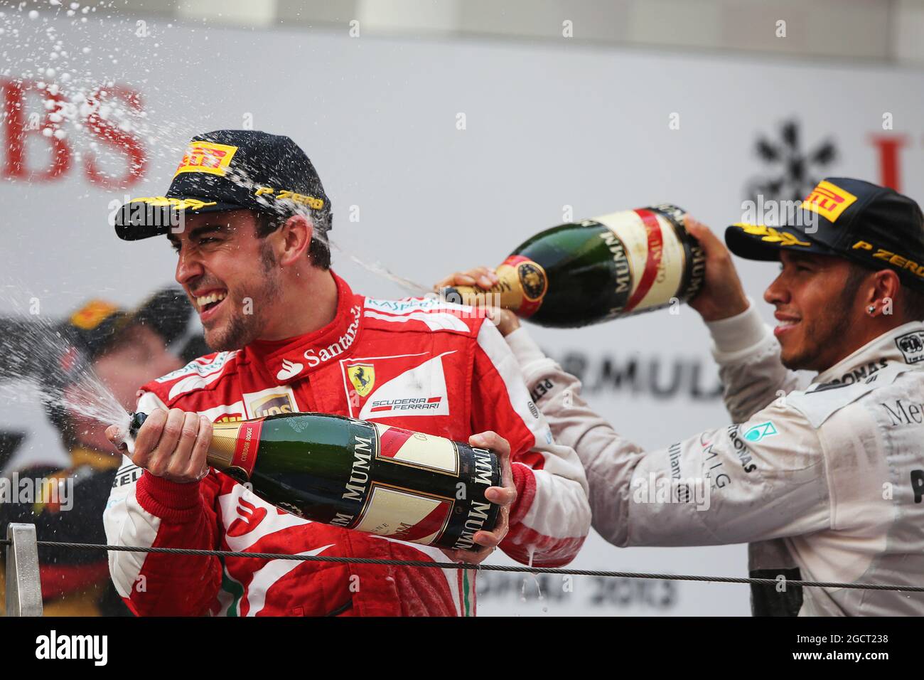 Race winner Fernando Alonso (ESP) Ferrari celebrates on the podium with ...
