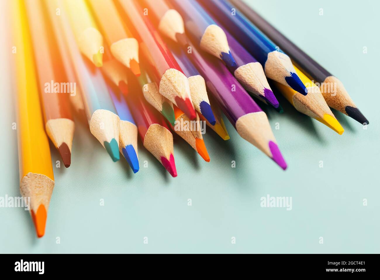 Sharp colored pencils for drawing lie on the table. Accessories for ...