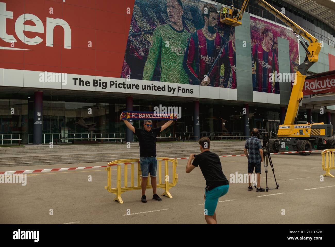 Barcelona, Spain. 10th Aug, 2021. Workers remove the portrait of Messi ...