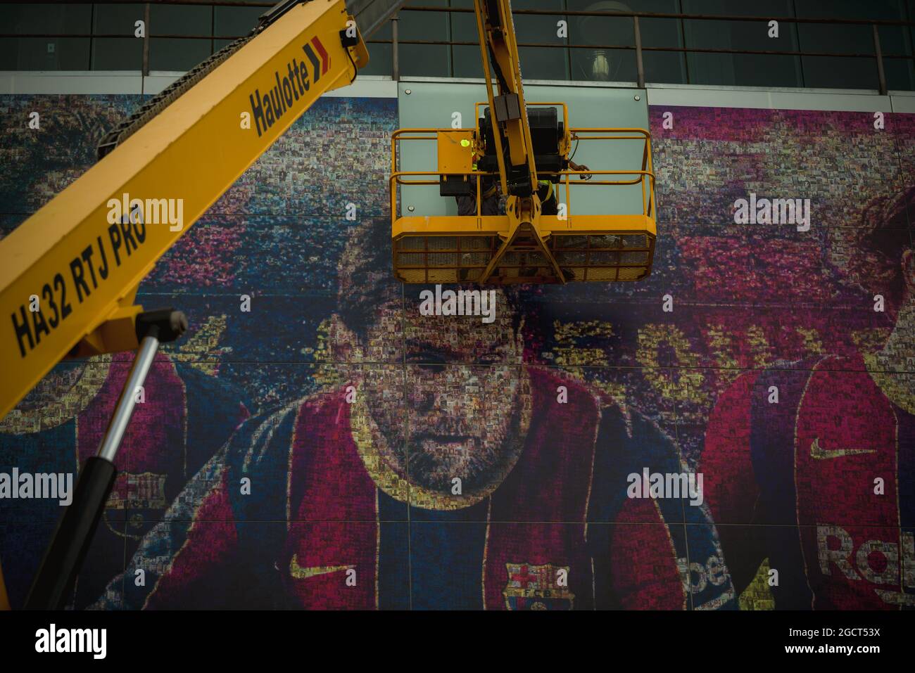 Barcelona, Spain. 10th Aug, 2021. Workers remove the portrait of Messi ...