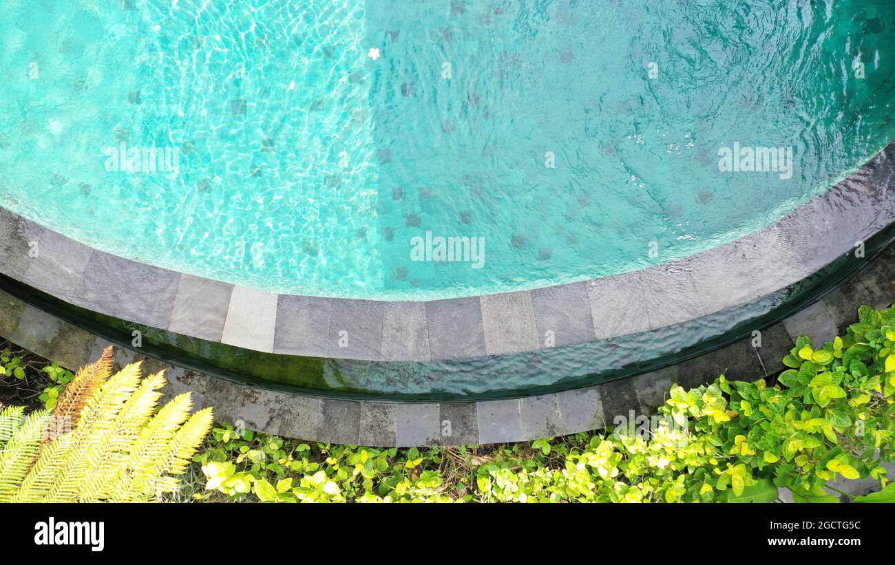 Top view of the edge of the infinity pool. Private villa with swimming ...