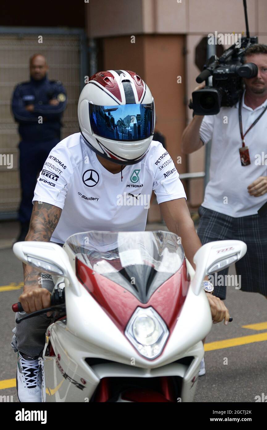 Lewis Hamilton (GBR) Mercedes AMG F1 arrives in the paddock on his ...