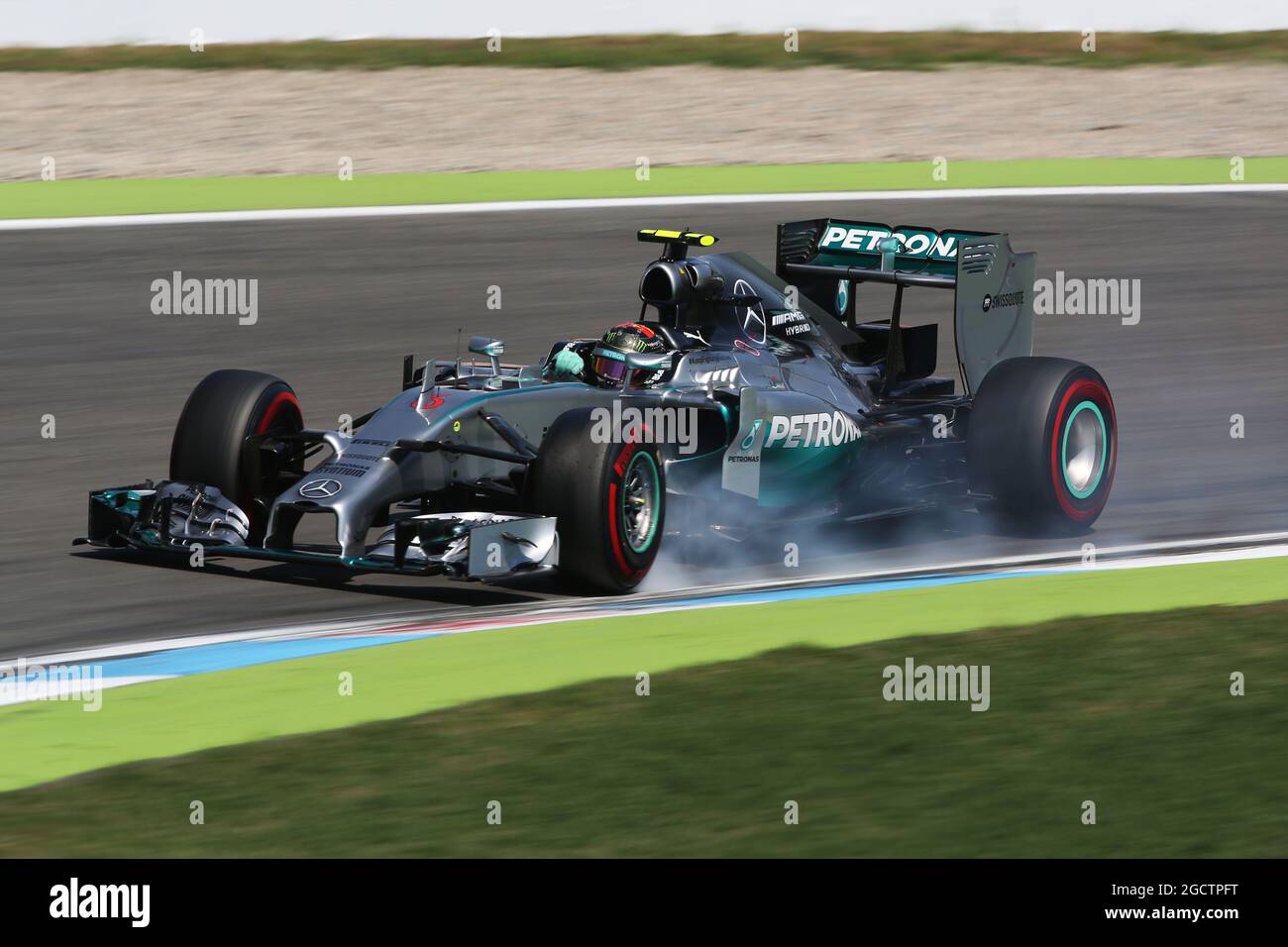 Nico Rosberg (GER) Mercedes AMG F1 W05 locks up under braking. German ...