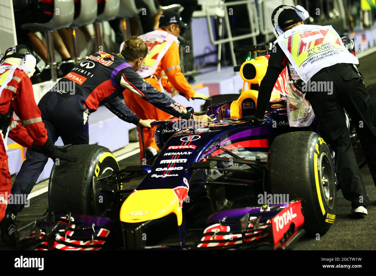 Sebastian Vettel (GER) Red Bull Racing RB10 stops at the end of FP1 and ...