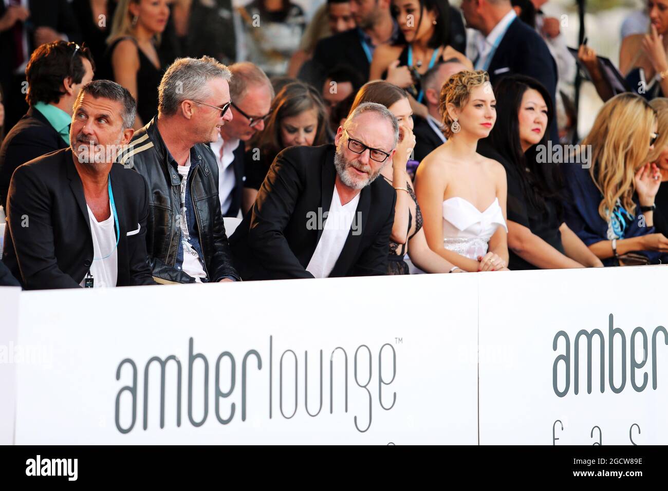 (L to R): Enrico Zanarini (ITA) Driver Manager; Eddie Irvine (GBR) and ...
