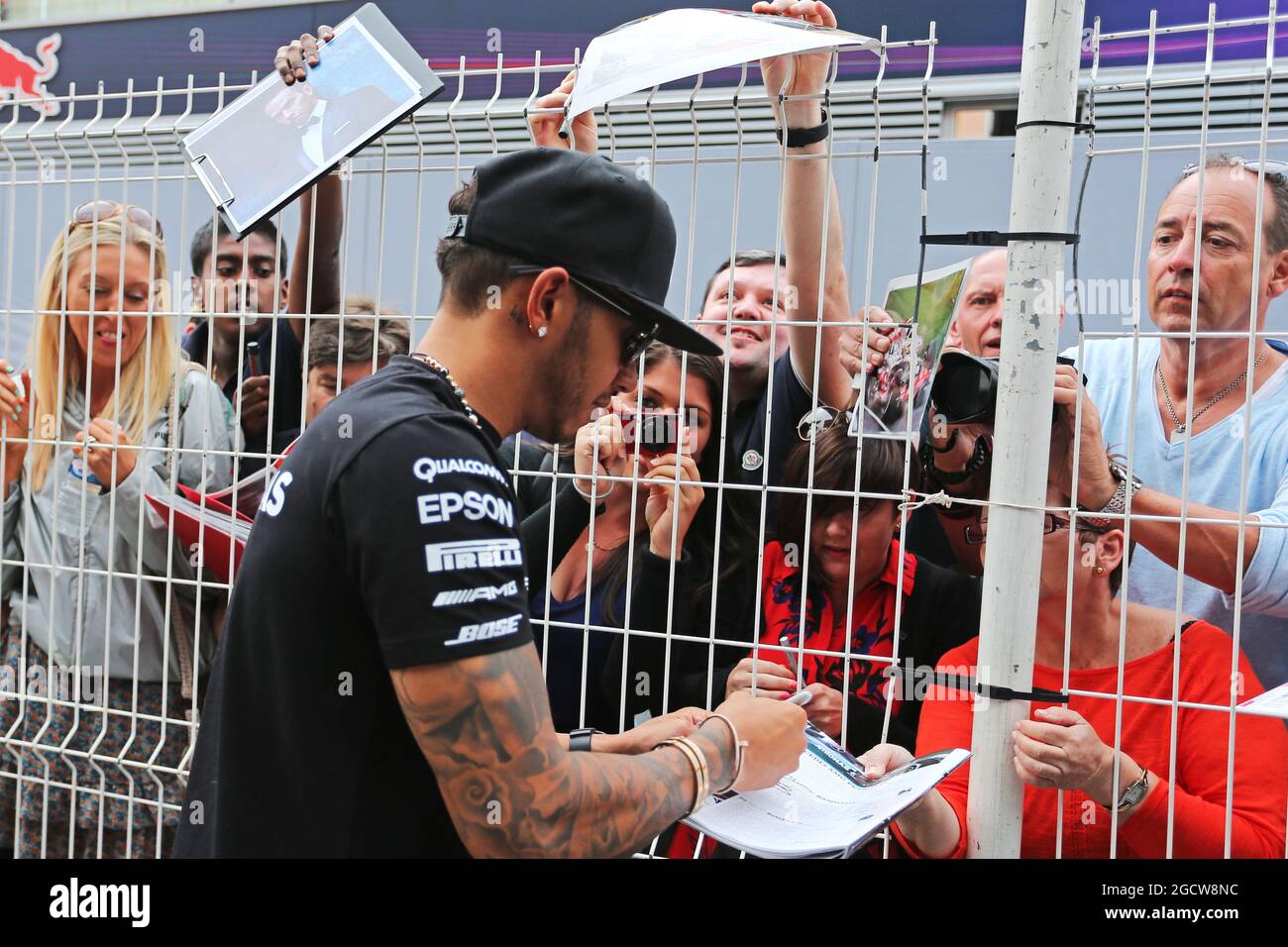 Lewis Hamilton (GBR) Mercedes AMG F1 signs autographs for the fans ...