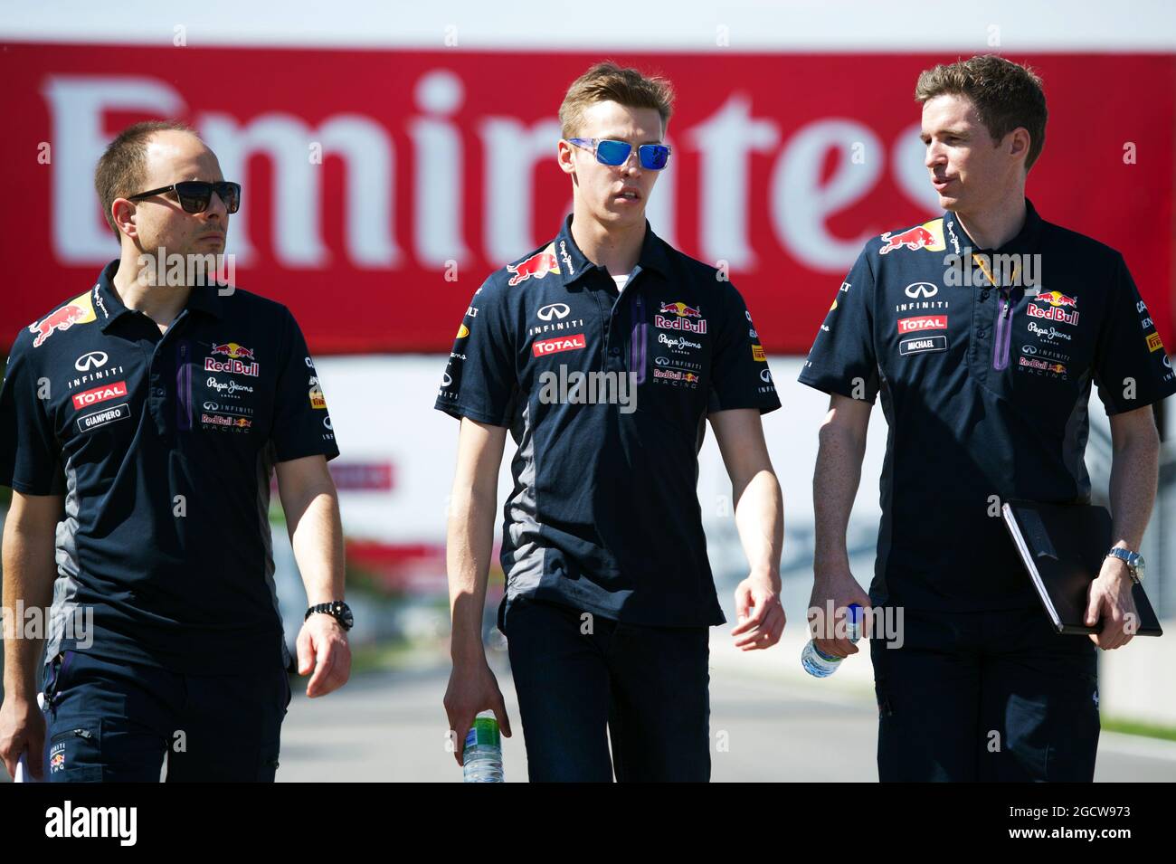 Daniil Kvyat (RUS) Red Bull Racing (Centre) walks the circuit with ...