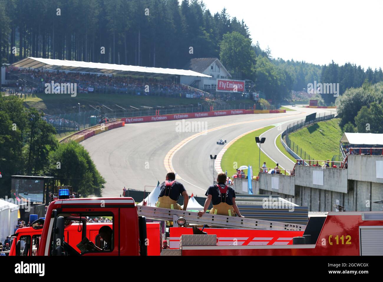 Two firemen watch the action at Eau Rouge Belgian Grand Prix, Saturday ...