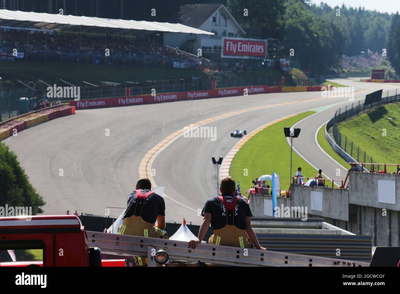 Two firemen watch action at eau rouge belgian grand prix hi-res stock ...