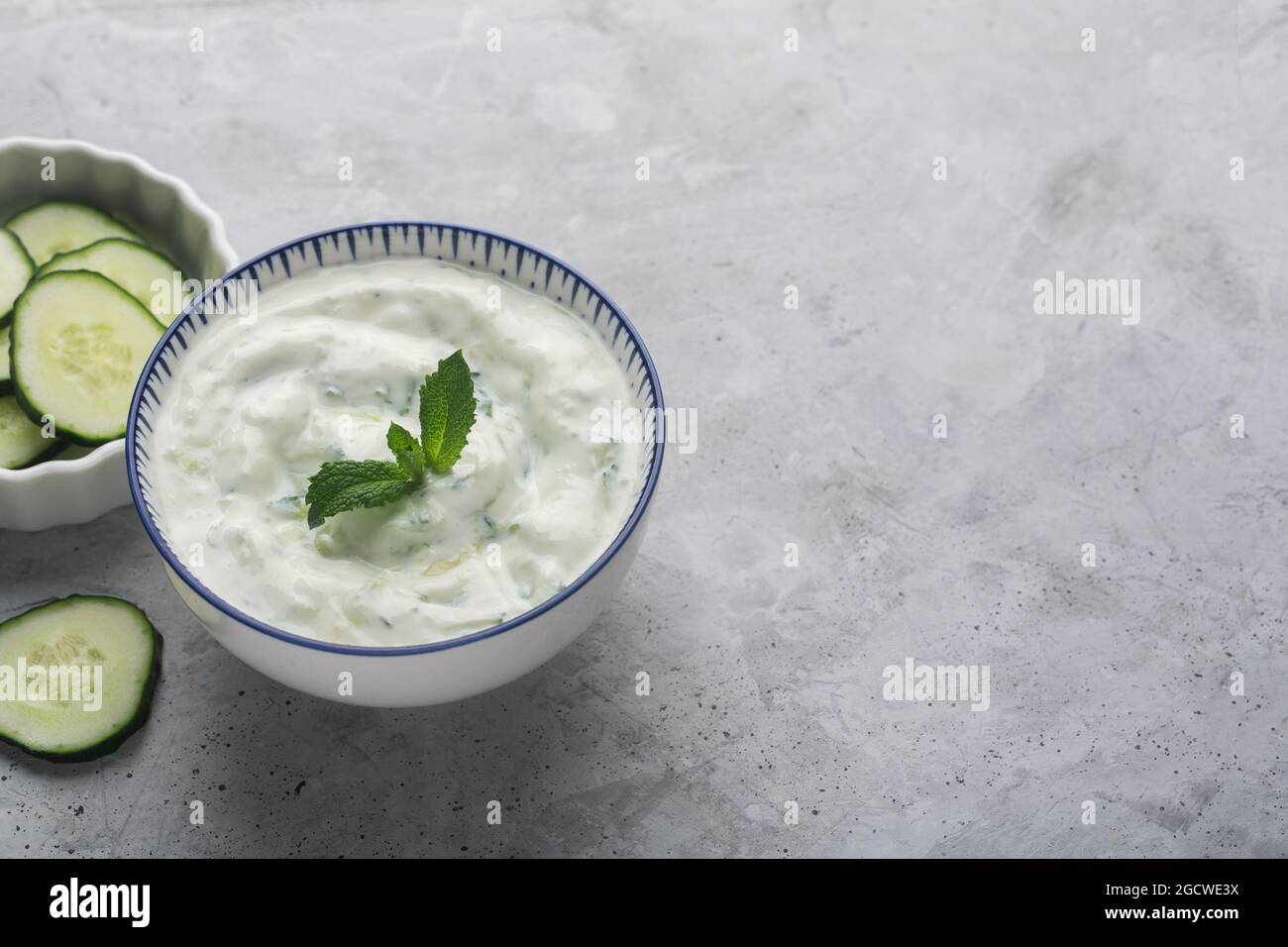 Traditional Indian Raita with cucumber, greek yoghurt and coriander on ...