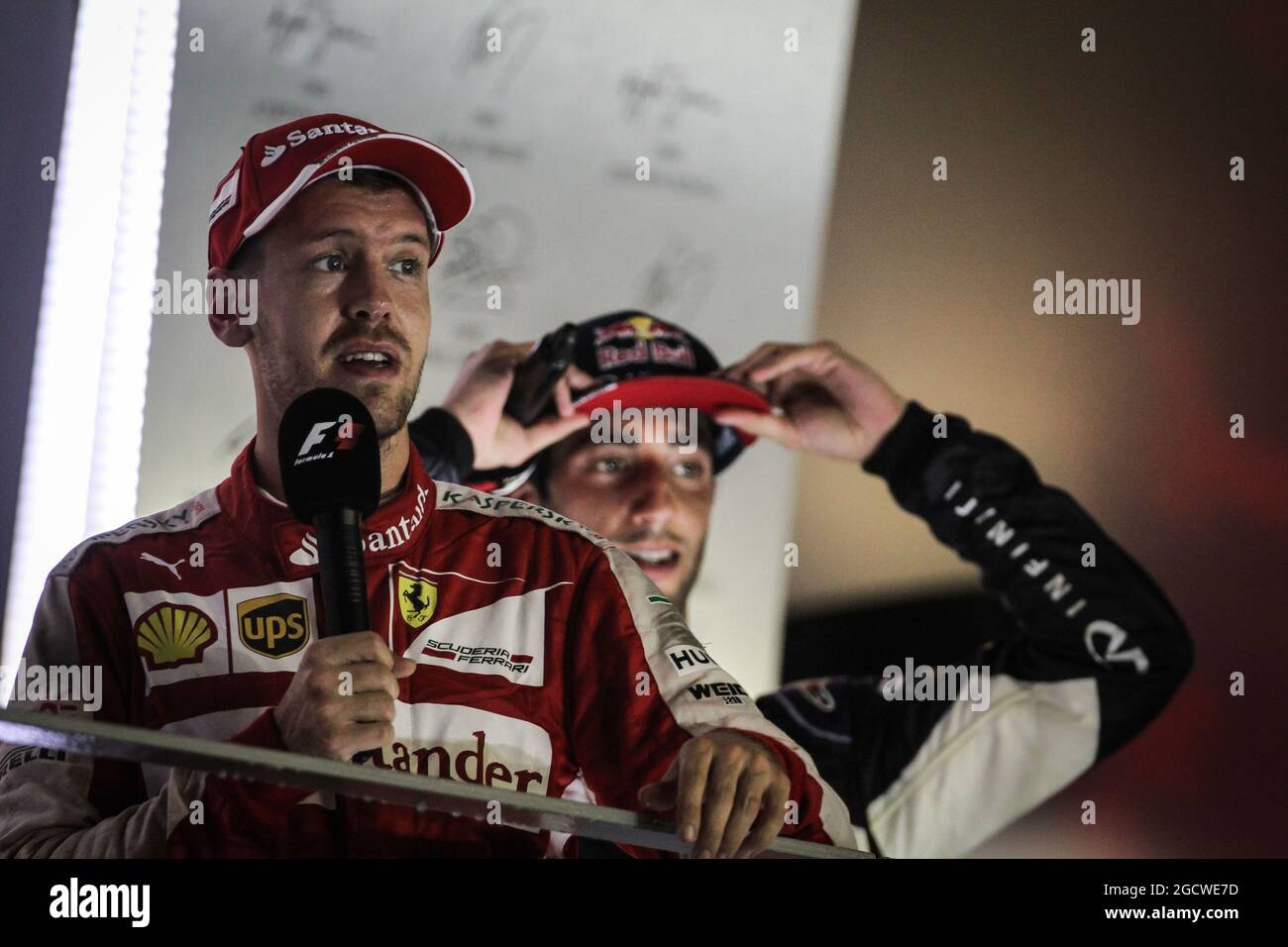 Race winner Sebastian Vettel (GER) Ferrari on the podium. Singapore ...
