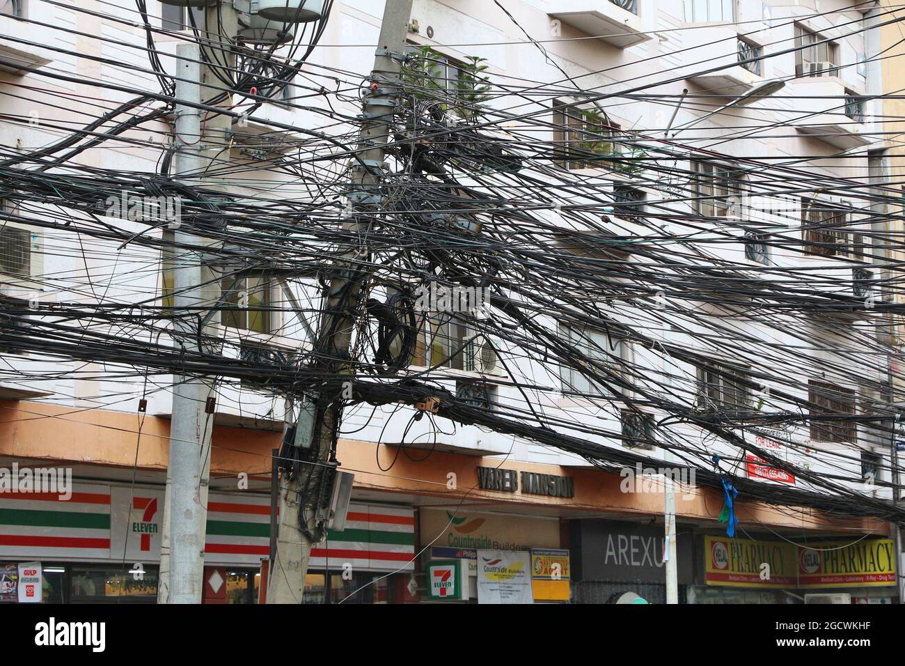 MANILA, PHILIPPINES - NOVEMBER 24, 2017: Tangled cables and chaotic ...