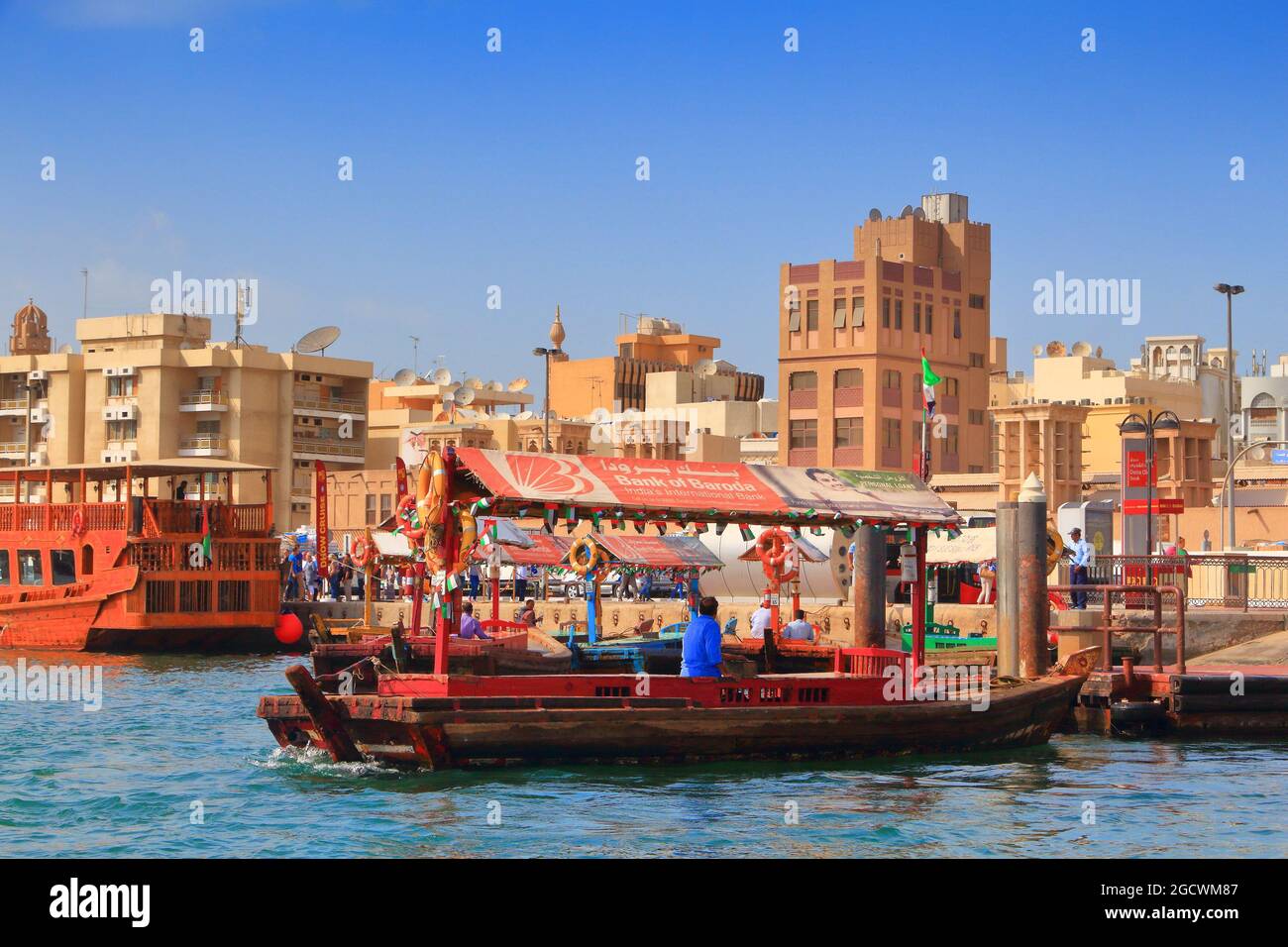 DUBAI, UAE - DECEMBER 9, 2017: People ride traditional abra ferry ...