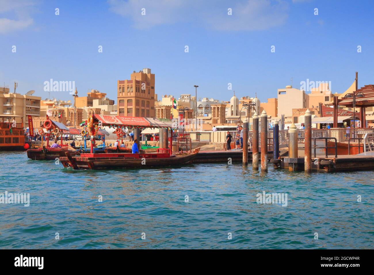 DUBAI, UAE - DECEMBER 9, 2017: People ride traditional abra ferry ...