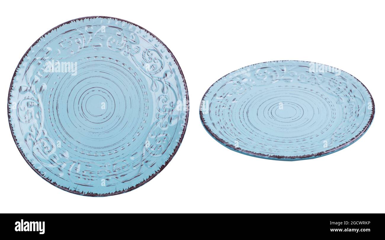 Blue ceramic plate isolated on white background. View from side and ...