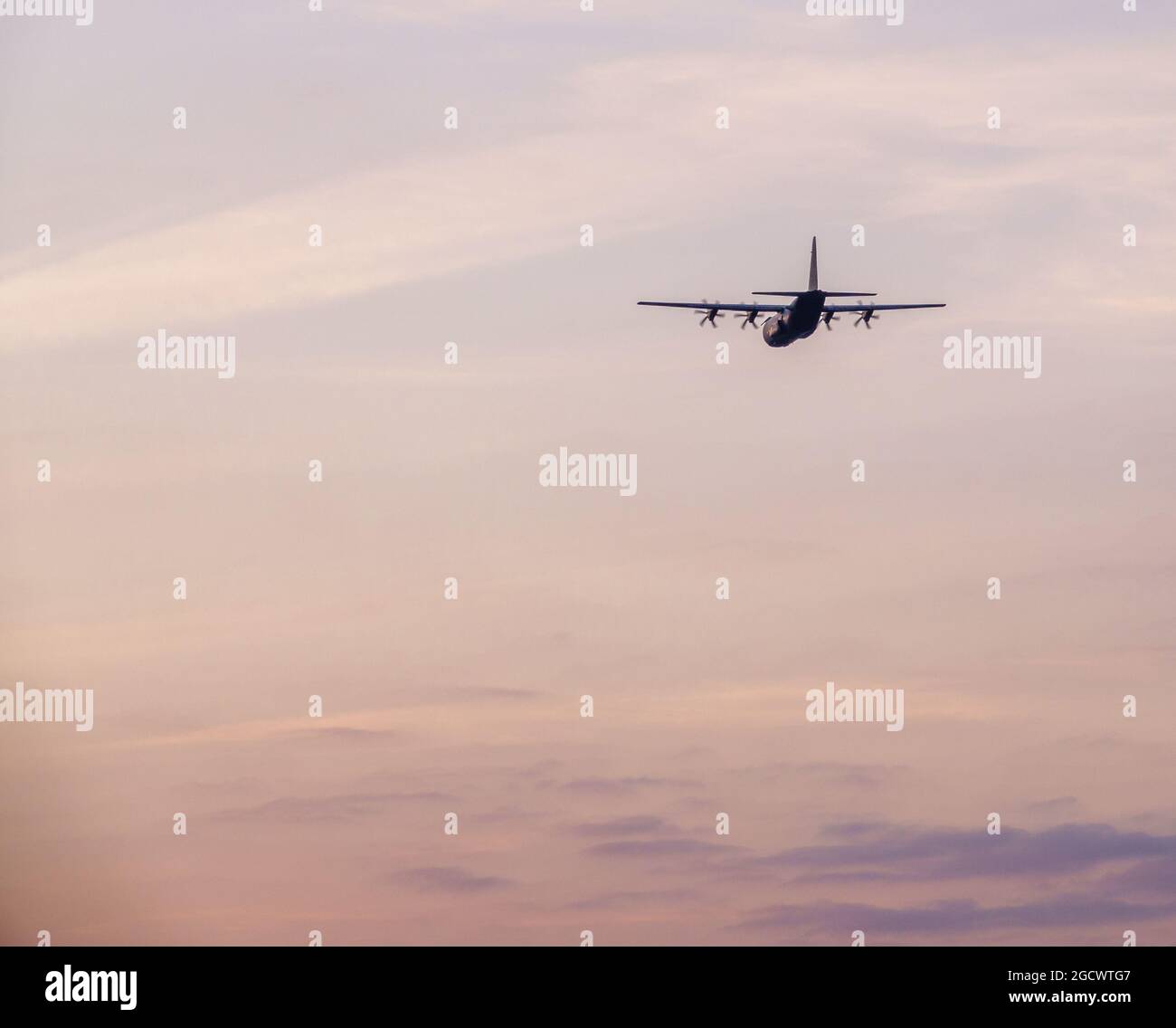 British RAF Lockheed Martin C-130J Hercules aircraft in a sunset sky on ...