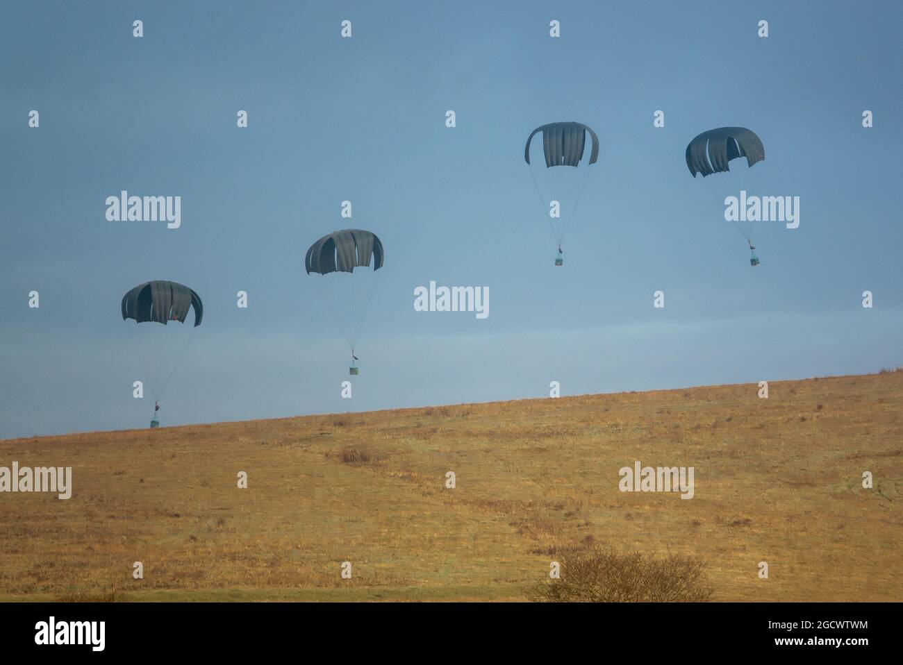 military pallet supplies parachute down, dropped by an RAF Airbus A400M ...