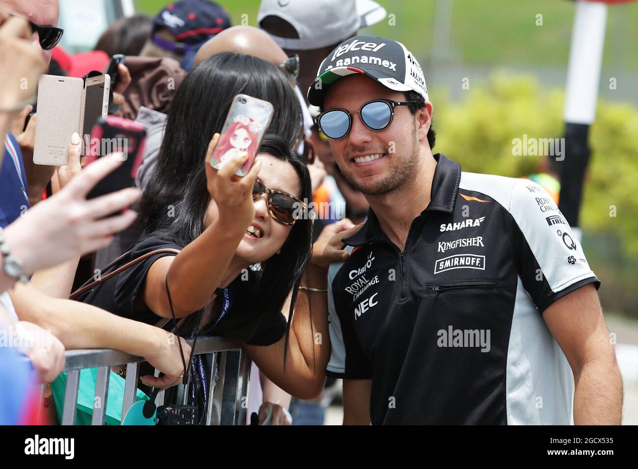 Sergio Perez (MEX) Sahara Force India F1 with fans. Malaysian Grand ...