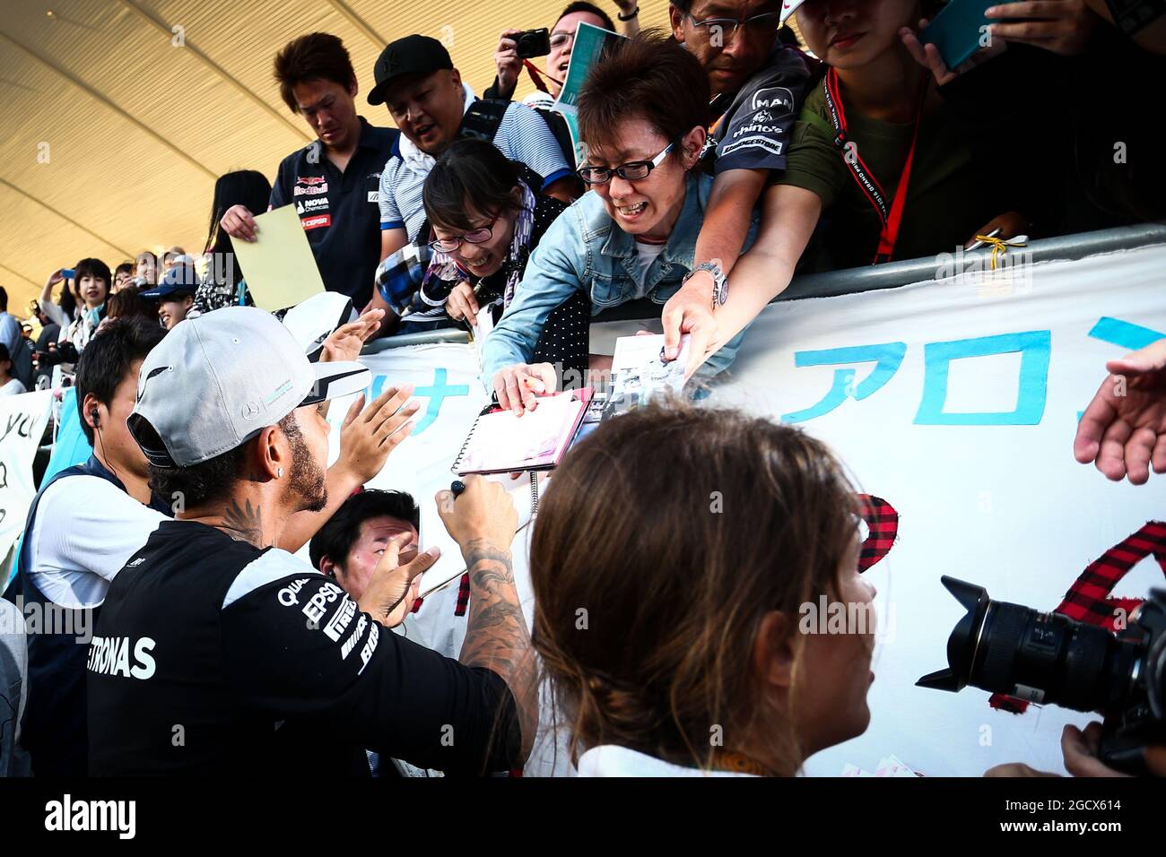 Lewis Hamilton (GBR) Mercedes AMG F1 signs autographs for the fans in ...