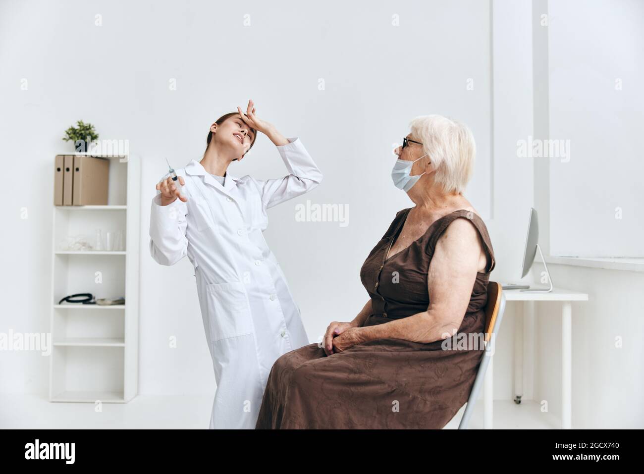 emotional nurse and patient syringe injection vaccine passport Stock ...