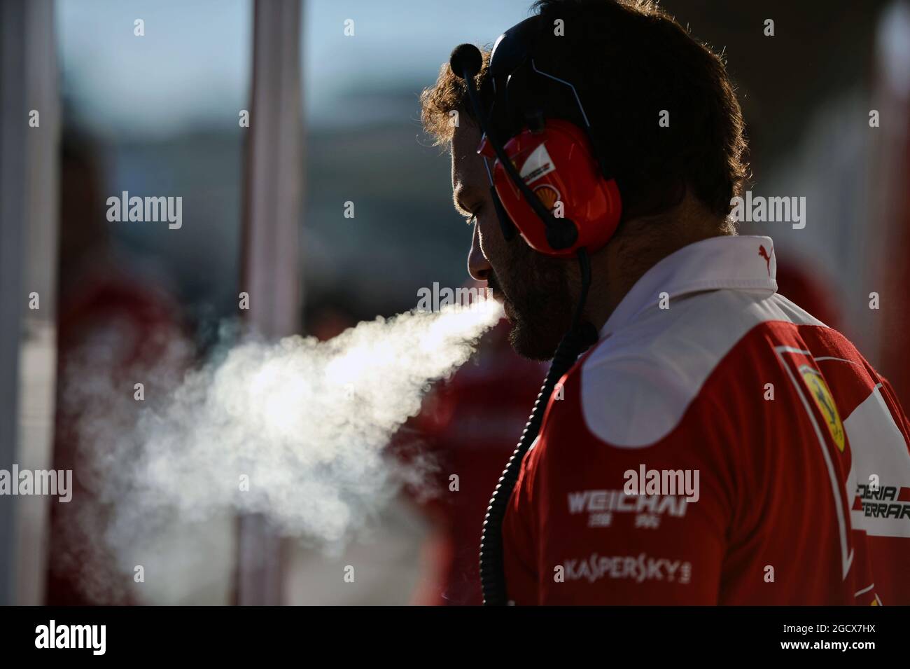 A Ferrari staff member smokes a cigarette. United States Grand Prix ...