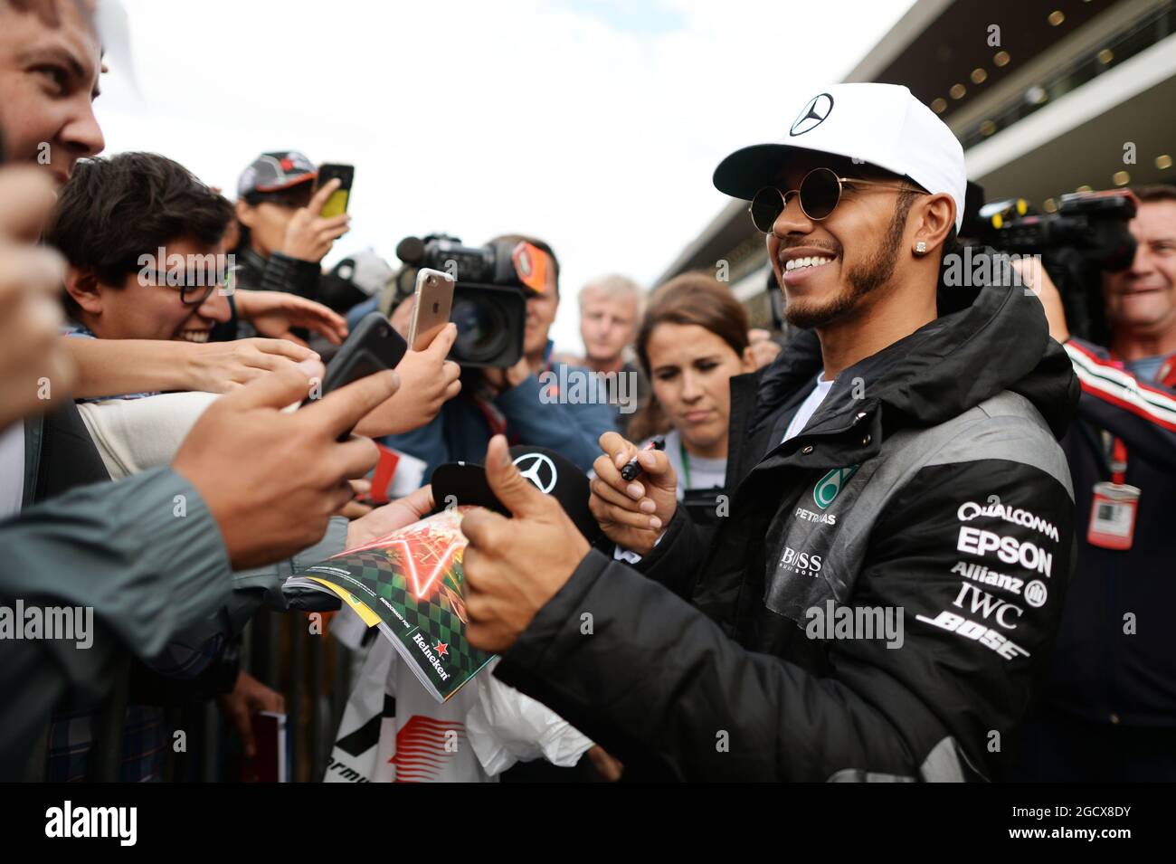 Lewis Hamilton (GBR) Mercedes AMG F1 signs autographs for the fans ...