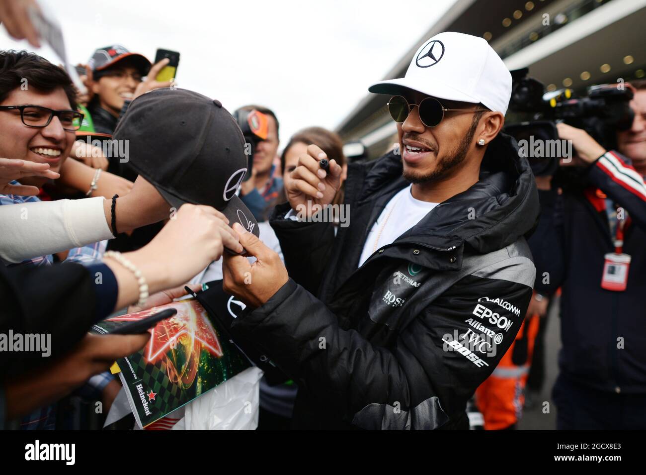 Lewis Hamilton (GBR) Mercedes AMG F1 signs autographs for the fans ...