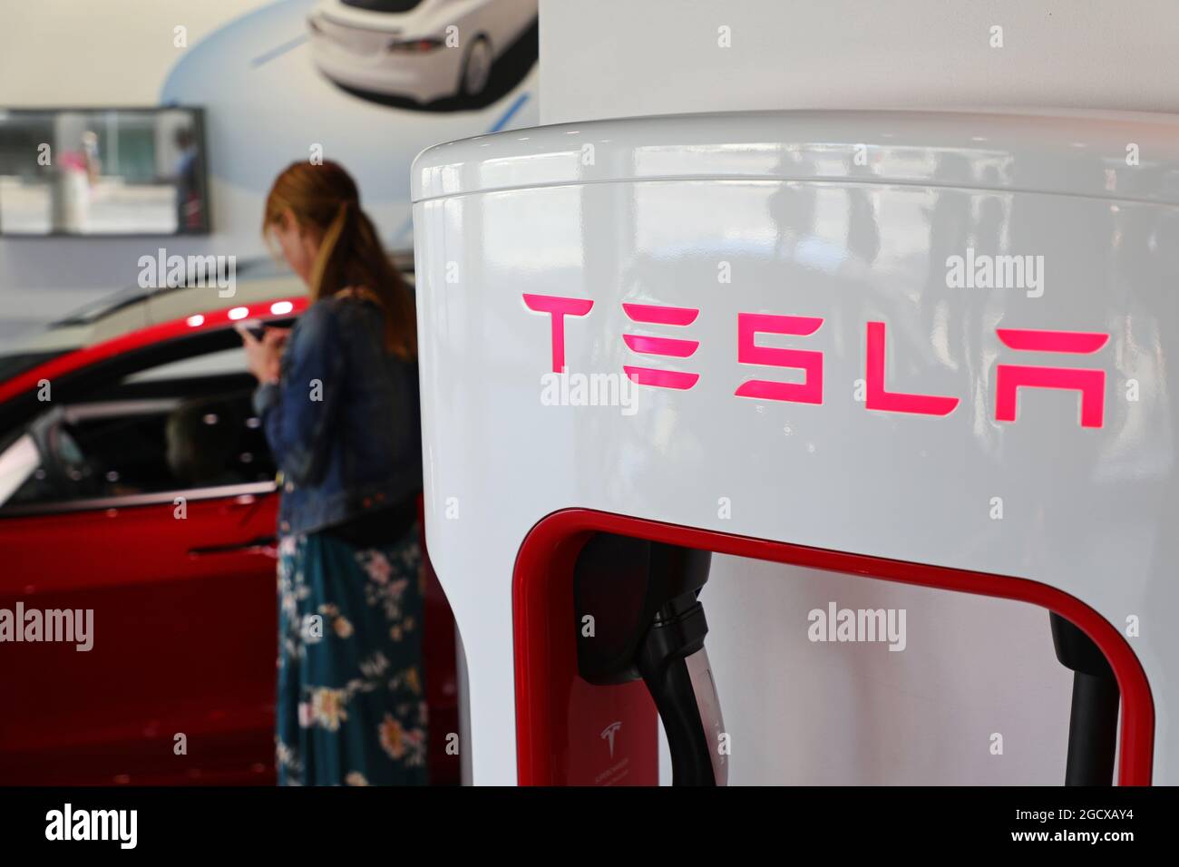 Tesla signs and charging station in a Tesla store at Södra Hamngatan in ...
