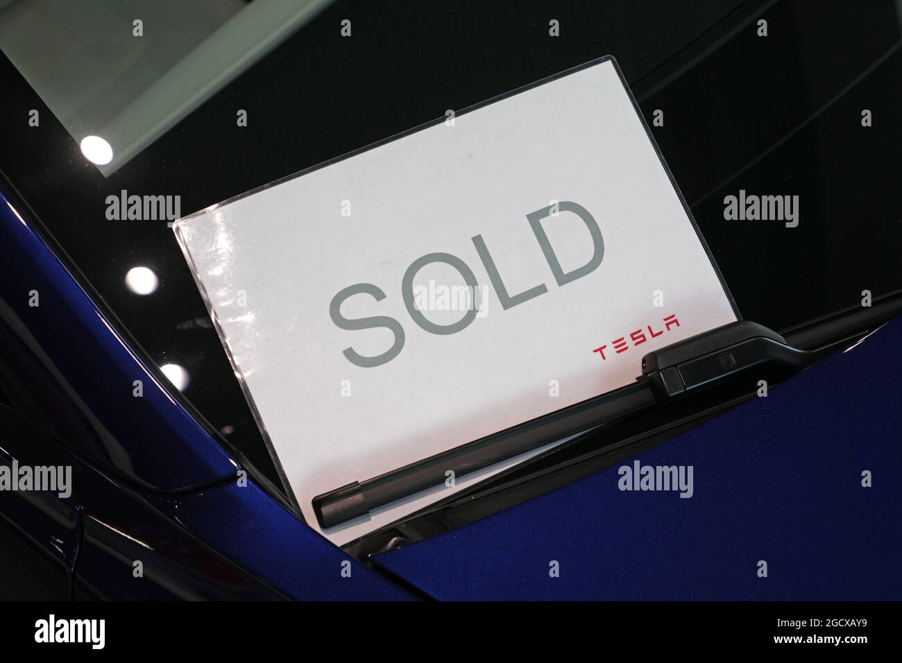 Sold signs at a Tesla car in a Tesla store at Södra Hamngatan in ...