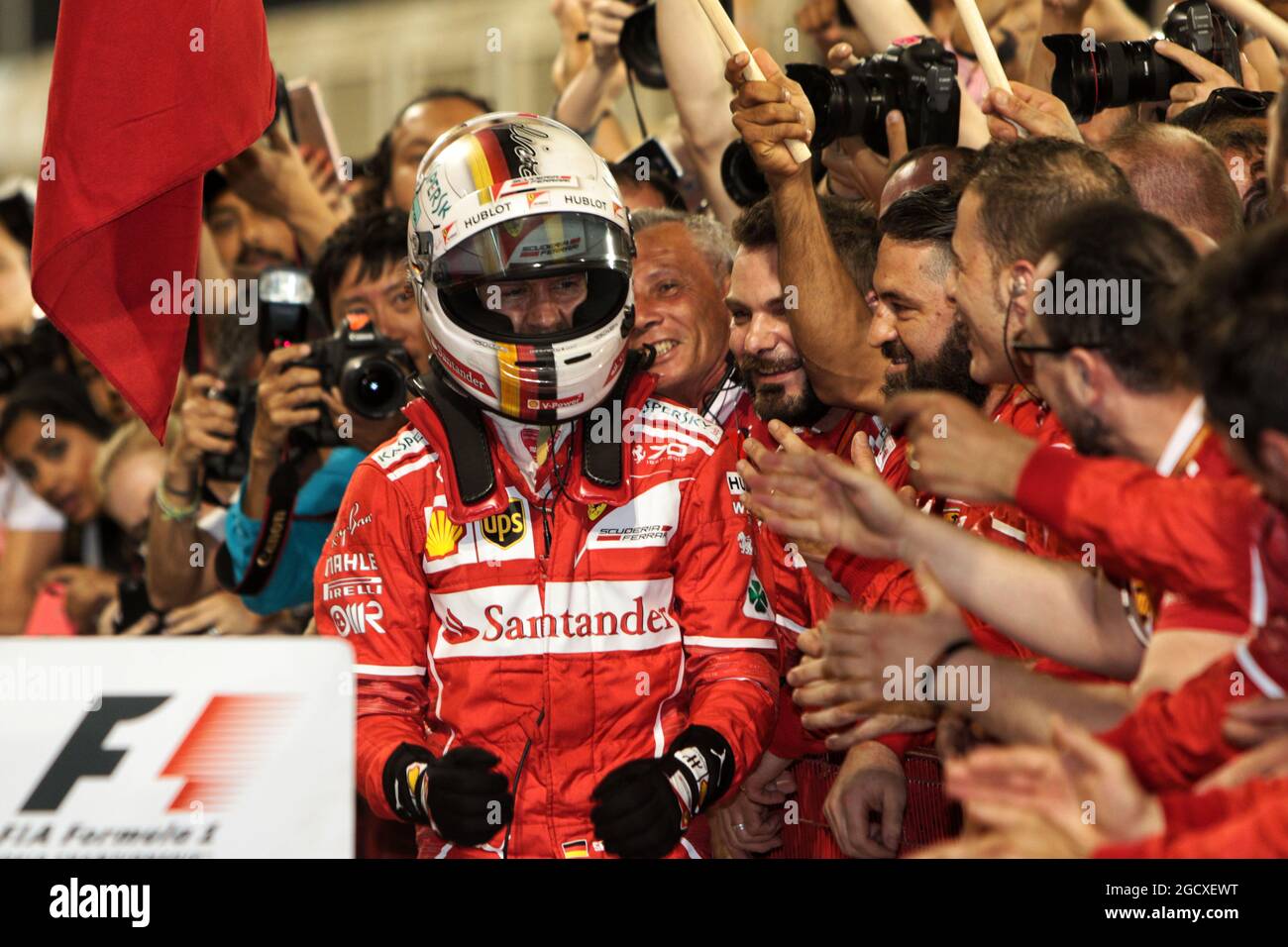 Race winner Sebastian Vettel (GER) Ferrari celebrates in parc ferme ...