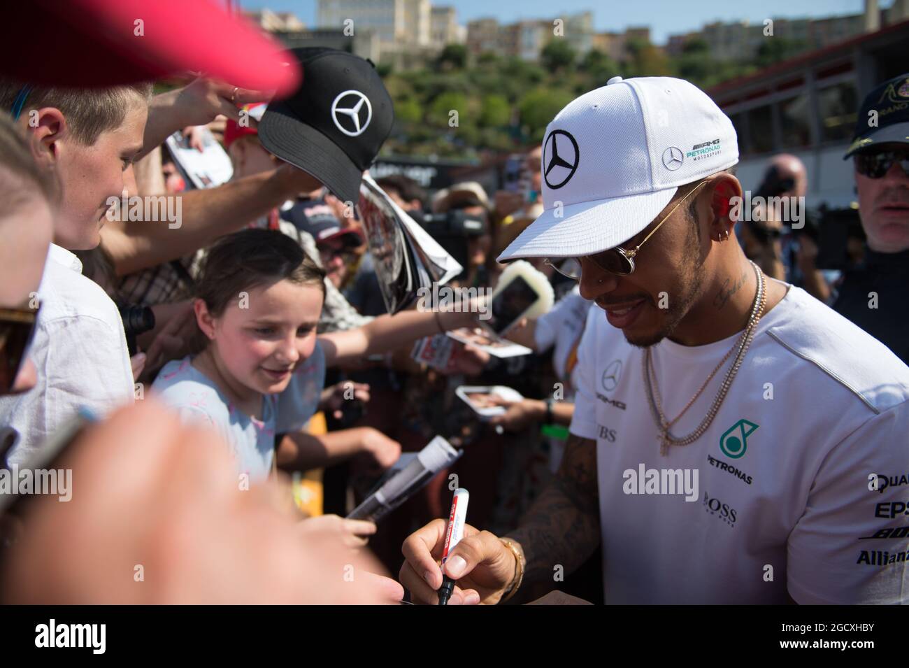 Lewis Hamilton (GBR) Mercedes AMG F1 signs autographs for the fans ...