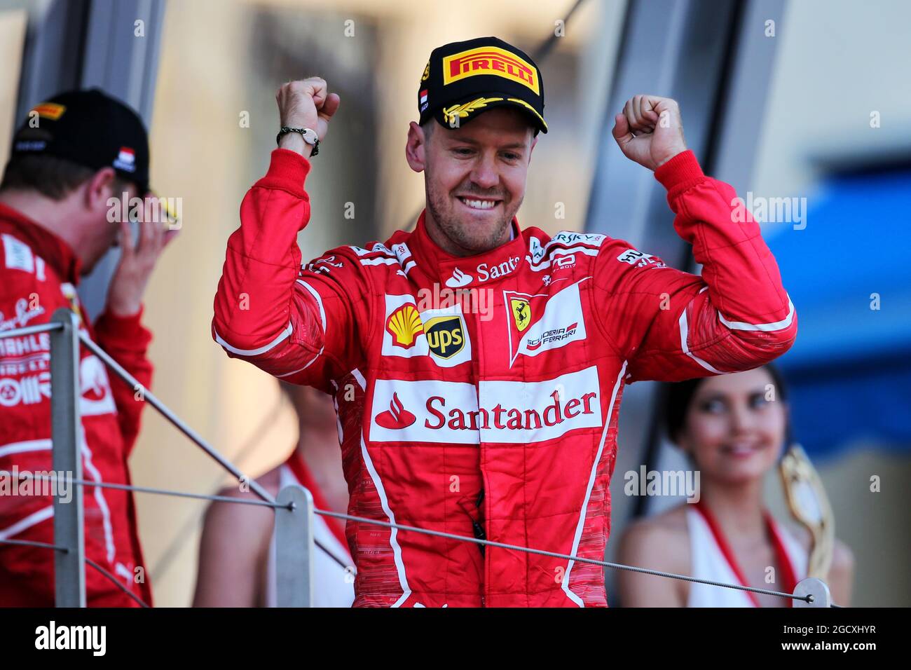 Race winner Sebastian Vettel (GER) Ferrari celebrates on the podium ...