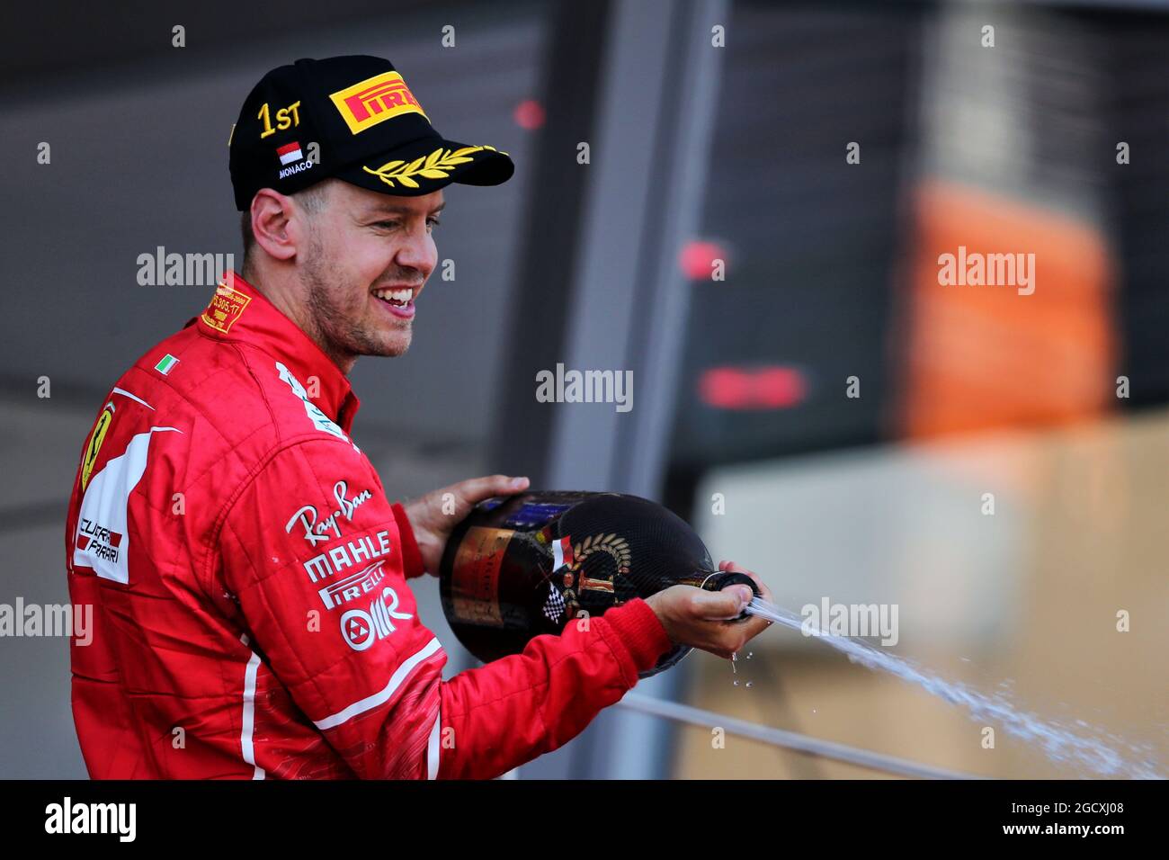 Race winner Sebastian Vettel (GER) Ferrari celebrates on the podium ...