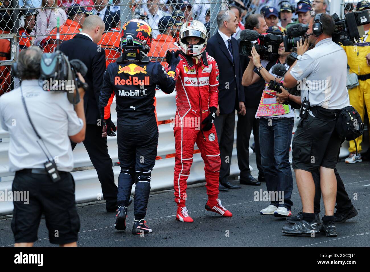 Race winner Sebastian Vettel (GER) Ferrari celebrates with third placed ...