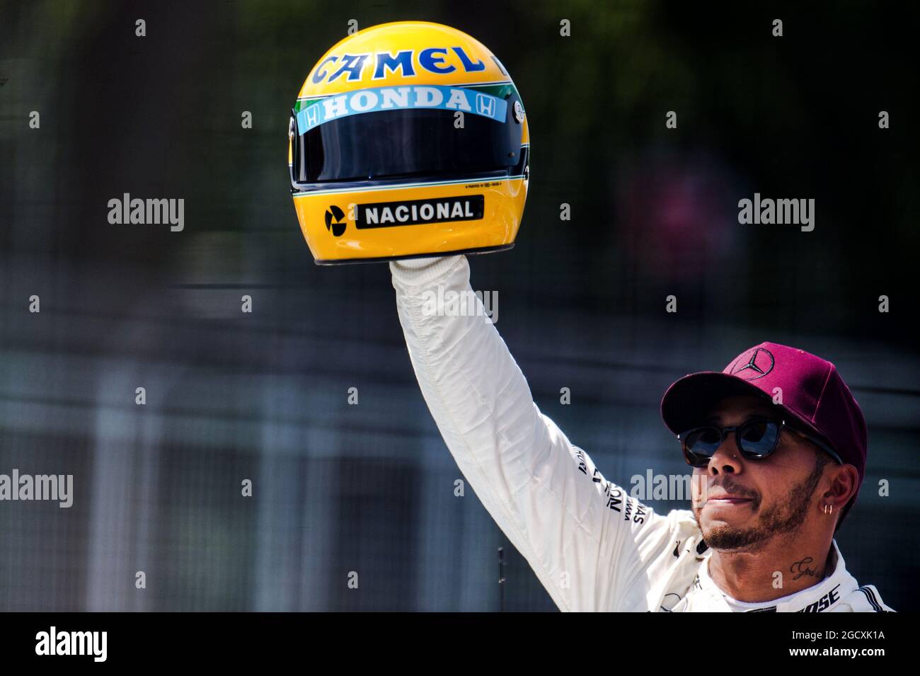 Lewis Hamilton (GBR) Mercedes AMG F1 with the helmet of Ayrton Senna ...