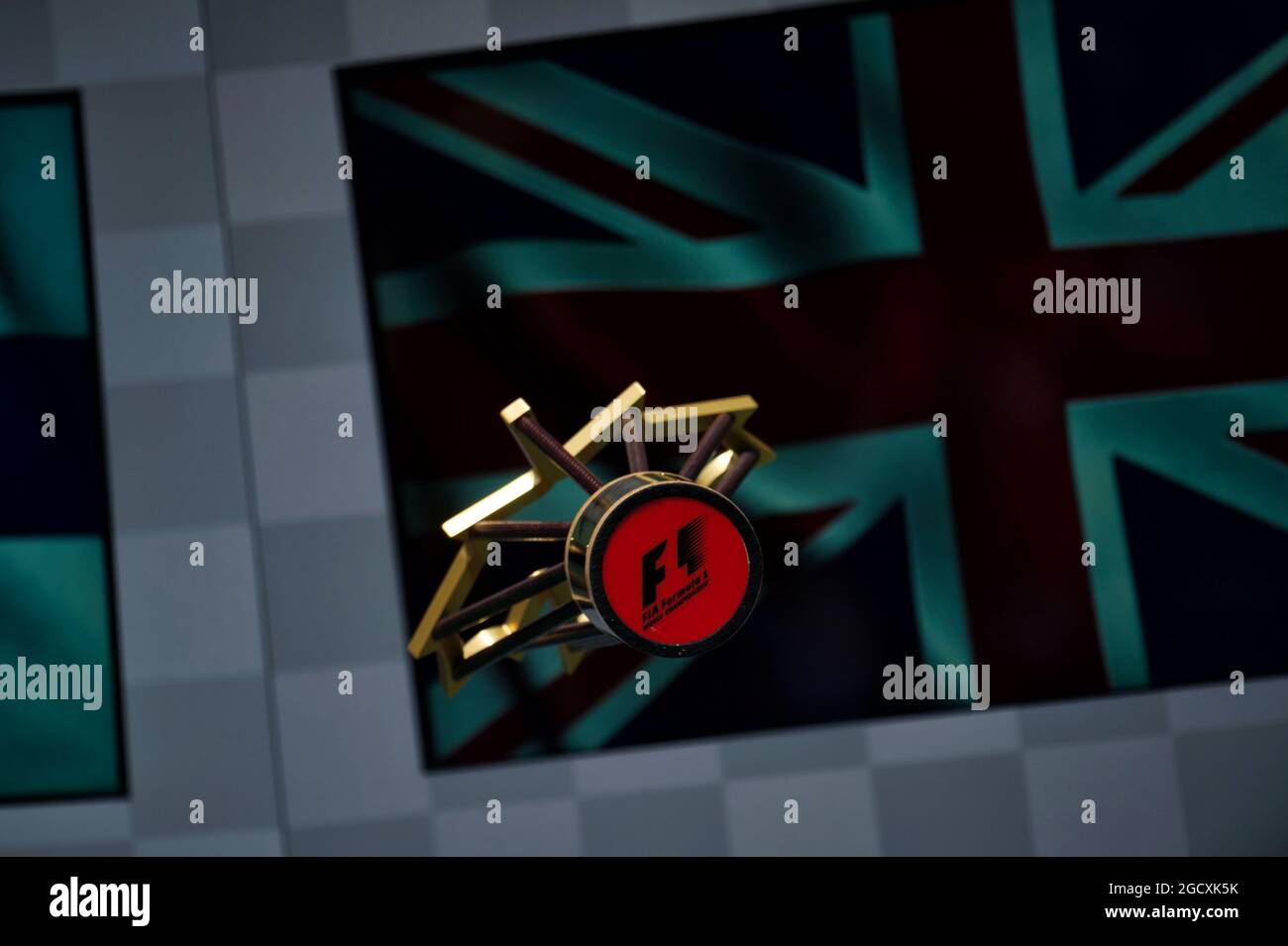 The trophy of Lewis Hamilton (GBR) Mercedes AMG F1 flies in the air at ...