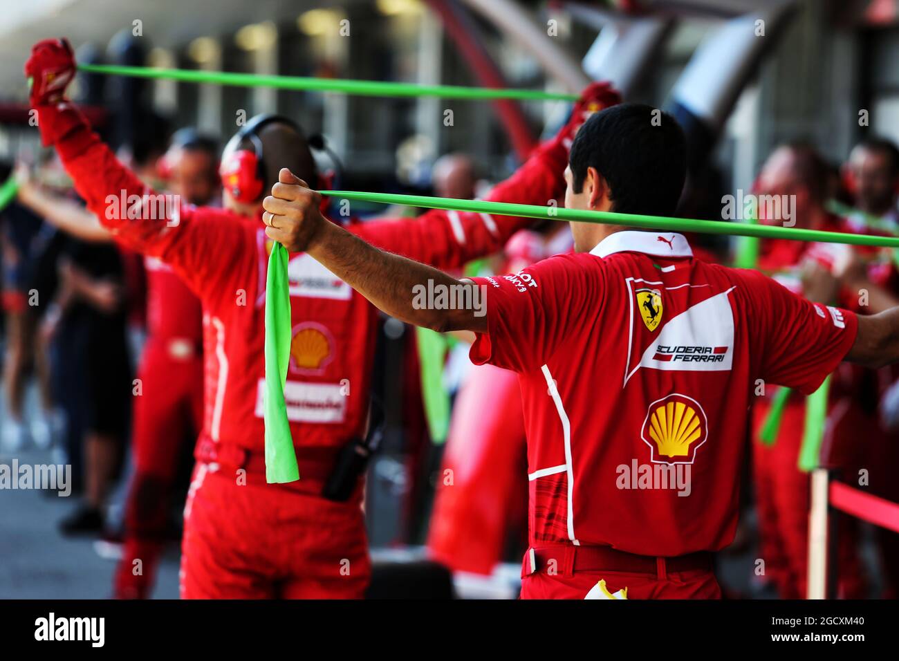 Ferrari mechanics practice warm up stretches hi-res stock photography ...
