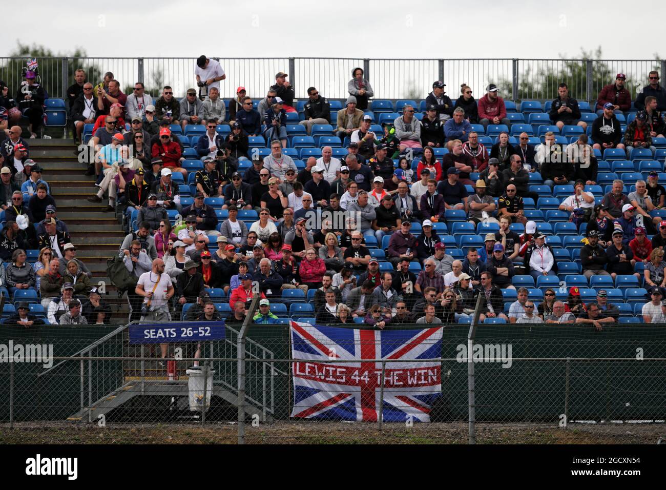 Fans in grandstand a flag for lewis hamilton hi-res stock photography ...