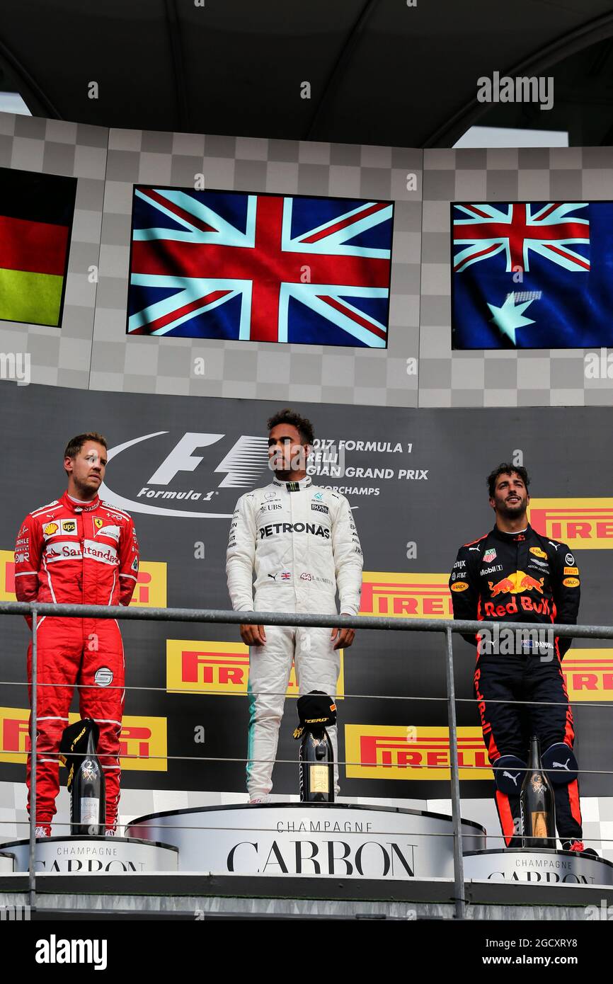 The podium (L to R): Sebastian Vettel (GER) Ferrari, second; Lewis ...