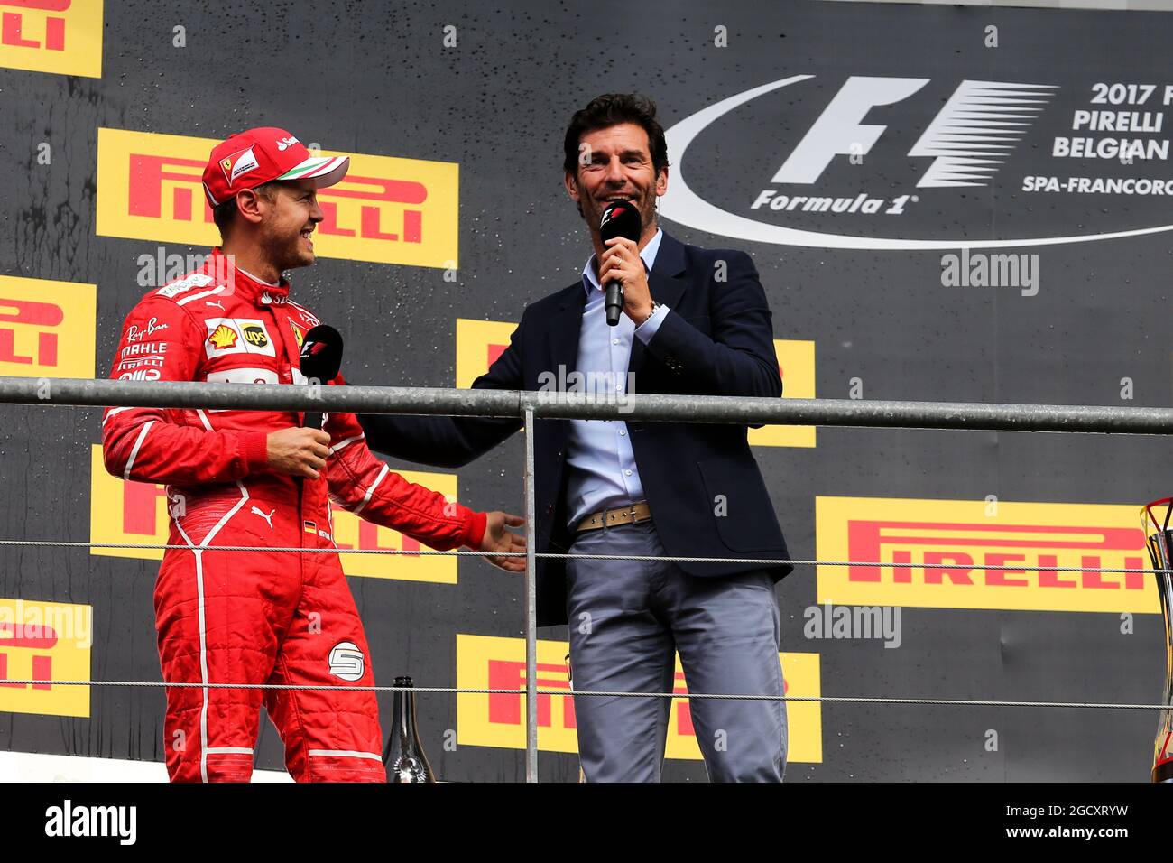 (L to R): Sebastian Vettel (GER) Ferrari with Mark Webber (AUS) Channel ...