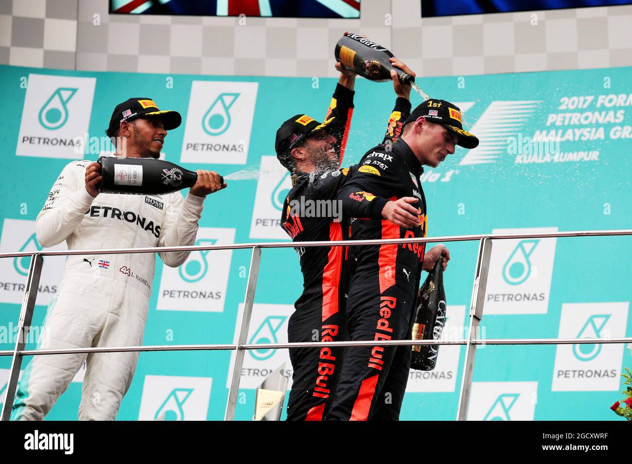 The podium (L to R): Lewis Hamilton (GBR) Mercedes AMG F1 celebrates ...