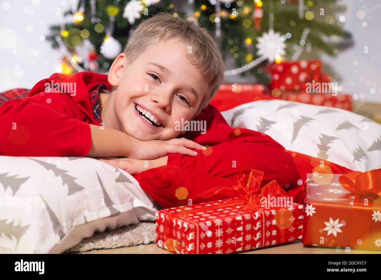 Portrait of Funny Smiling Boy Looking at the Camera, Lies Surrounded by ...